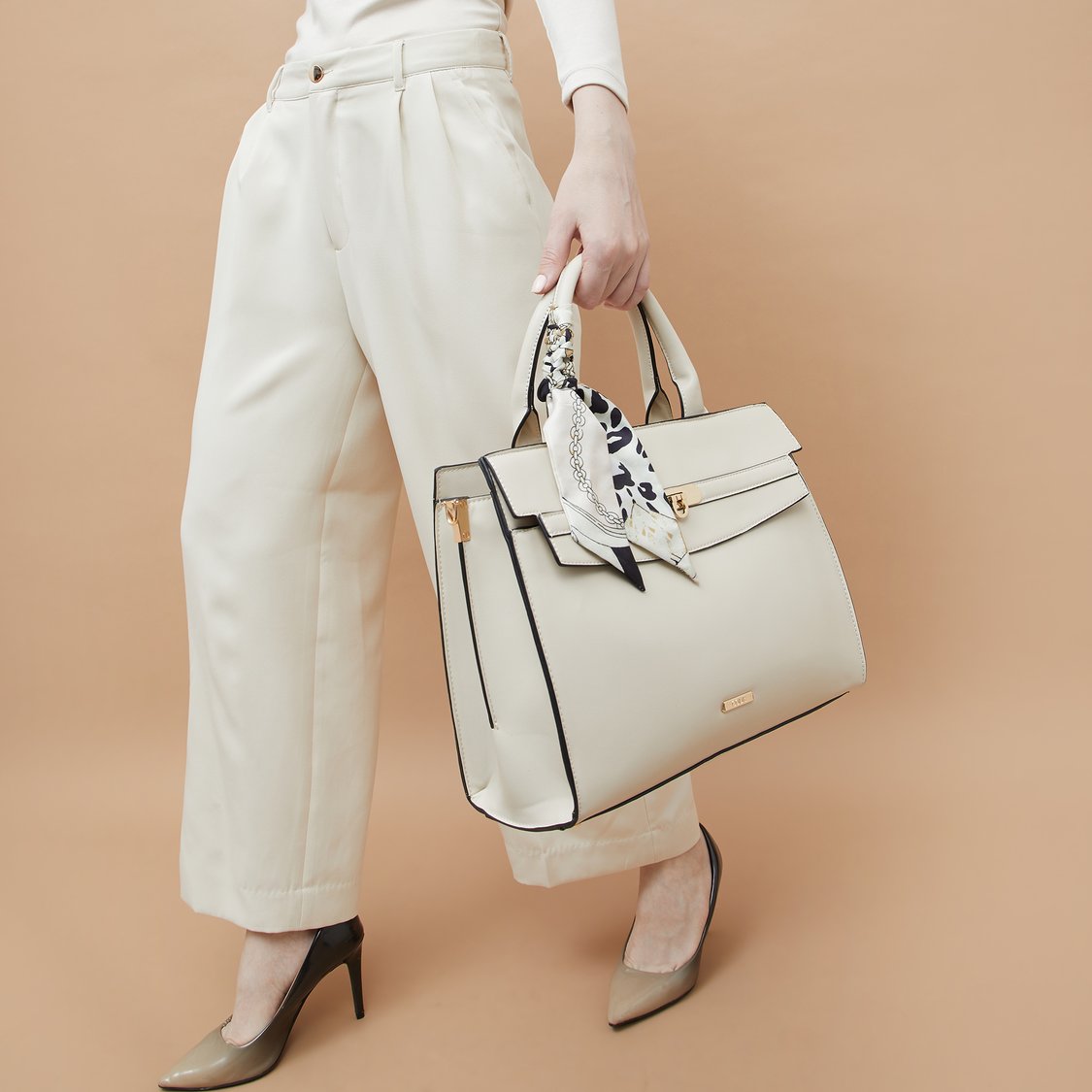 Buy CODE Solid Shoulder Bag from CODE at just INR 2499.0