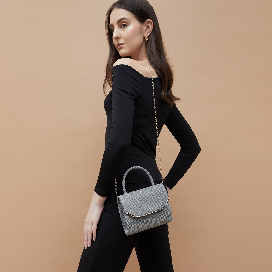 Buy CODE Textured Sling Bag from CODE at just INR 1299.0