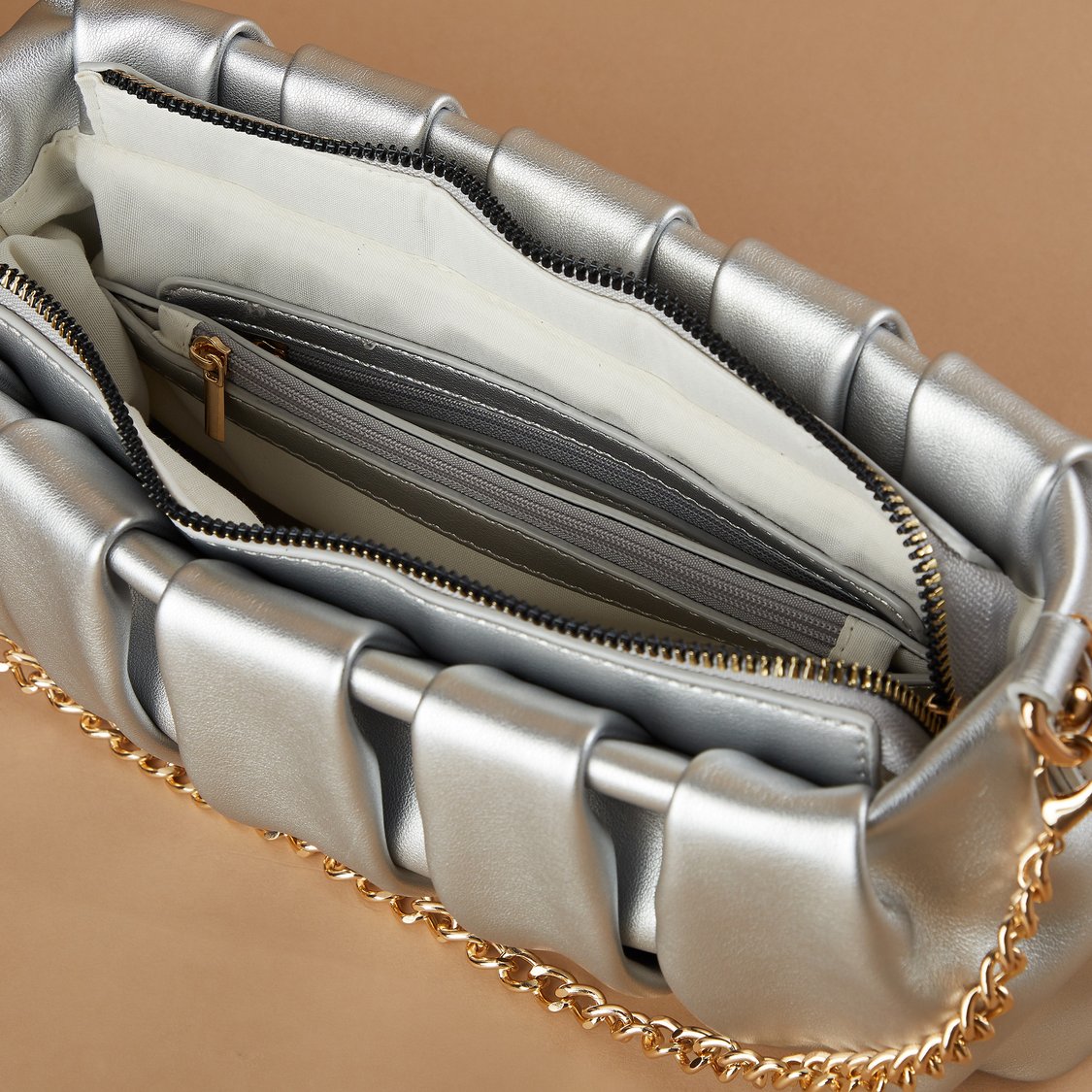 Buy CODE Glossy Embellished Sling Bag from CODE at just INR 2299.0