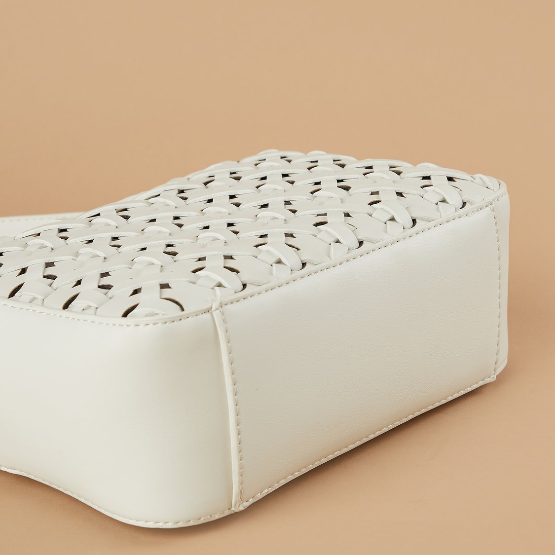 Buy CODE Braided Sling Bag from CODE at just INR 2699.0