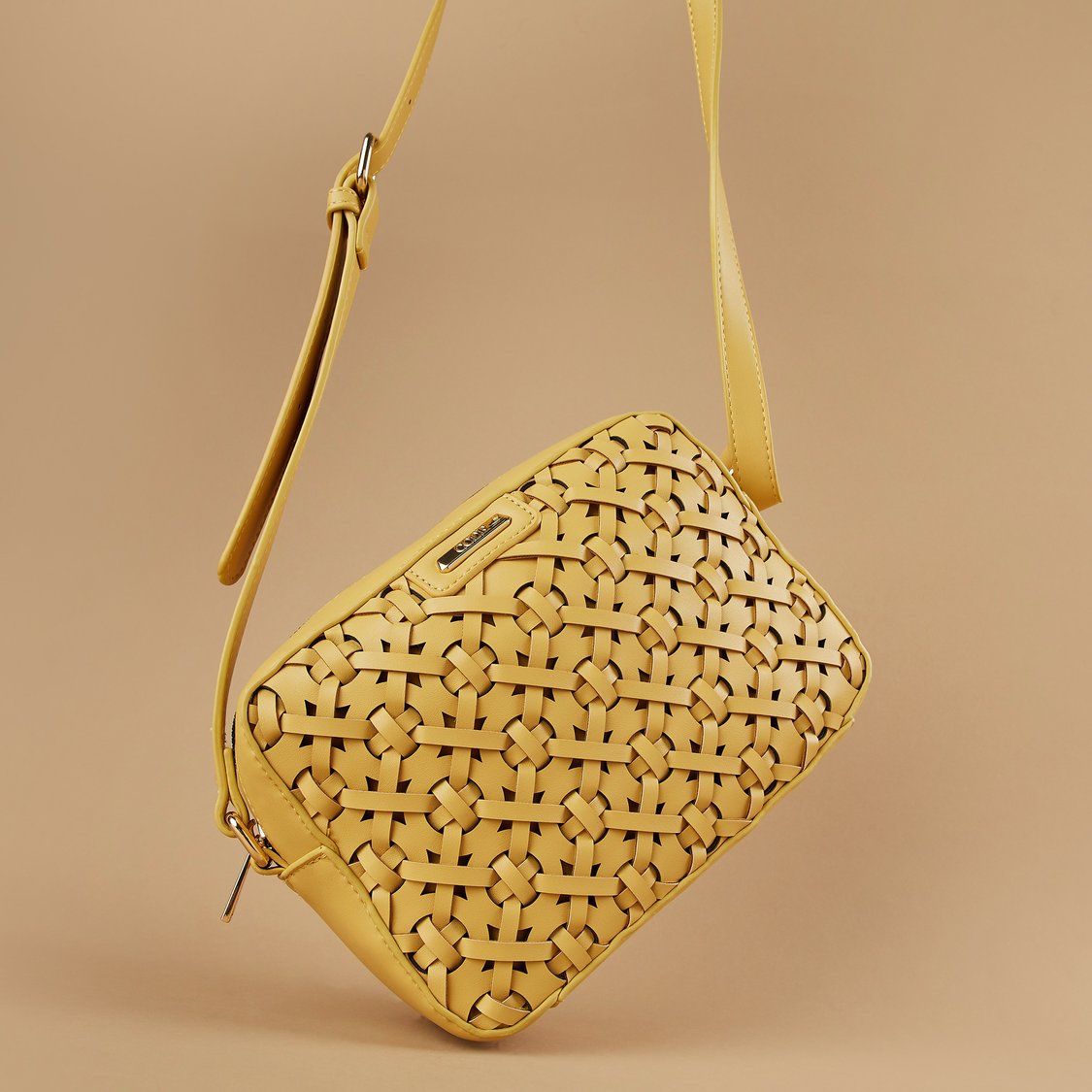 Buy CODE Braided Sling Bag from CODE at just INR 2699.0