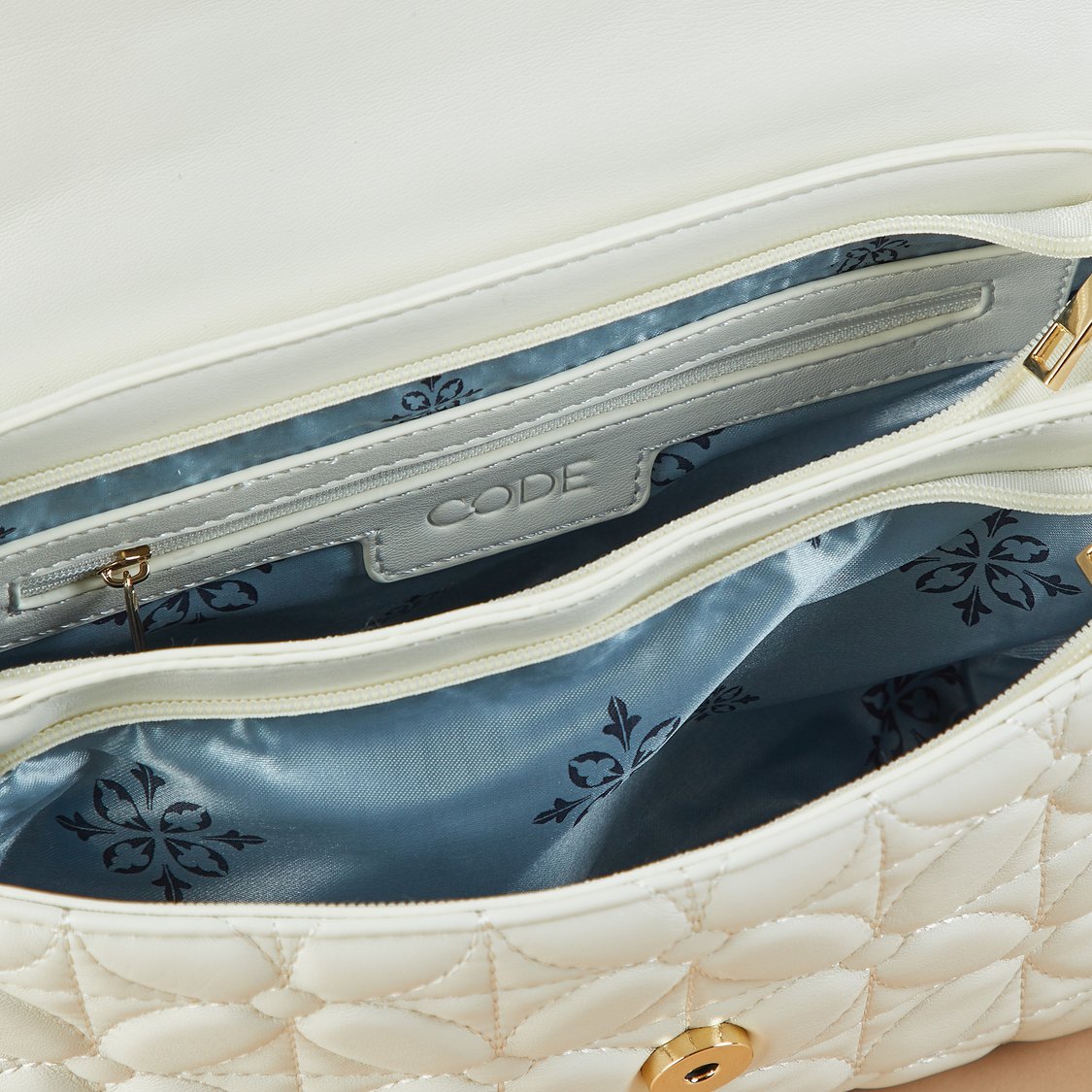 Buy CODE Quilted Sling Bag from CODE at just INR 2299.0