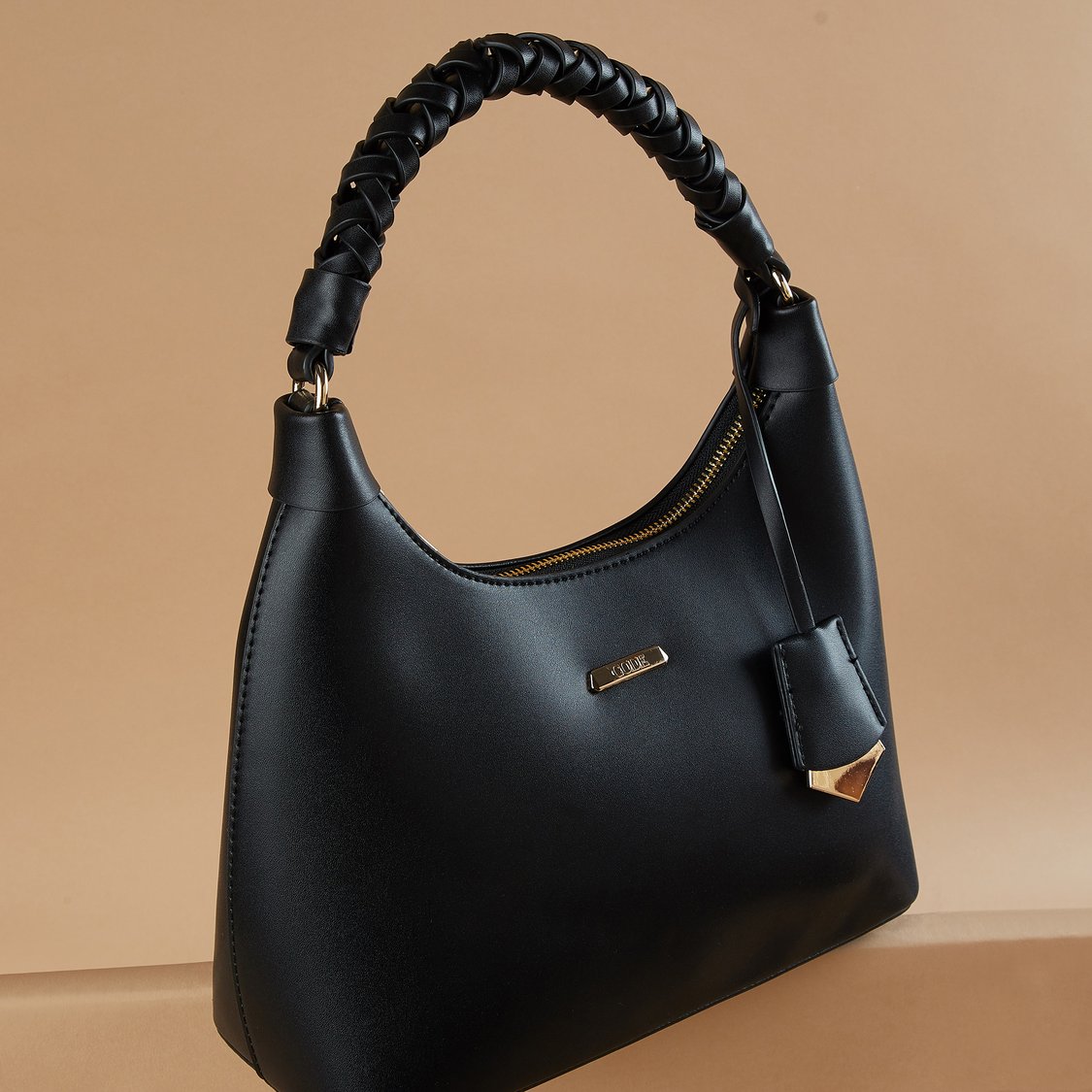 Buy CODE Solid Handheld Bag from CODE at just INR 1999.0