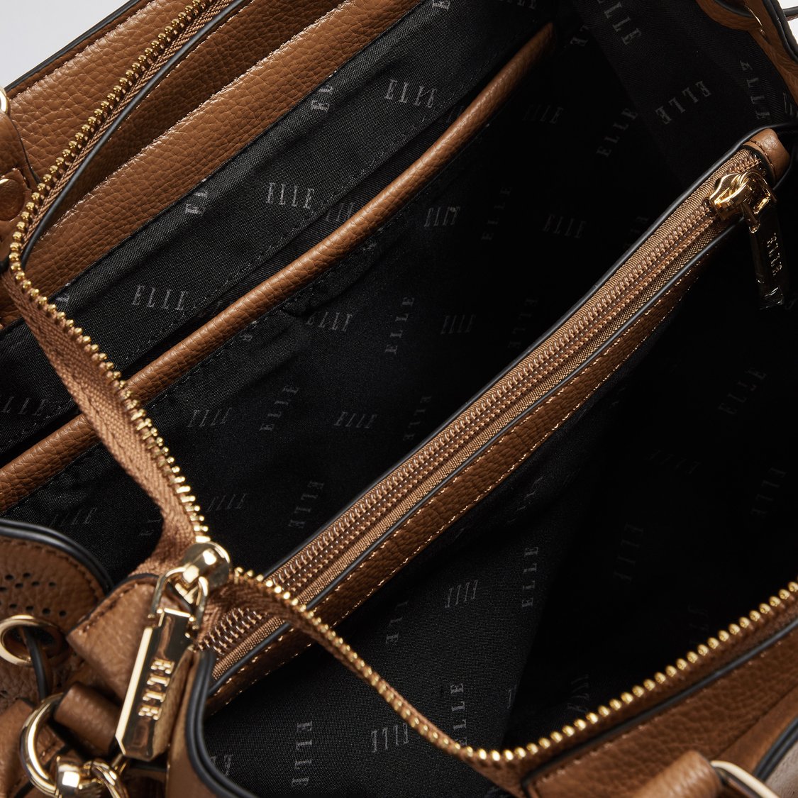 Buy ELLE Perforated Handheld Bag from Elle at just INR 5499.0