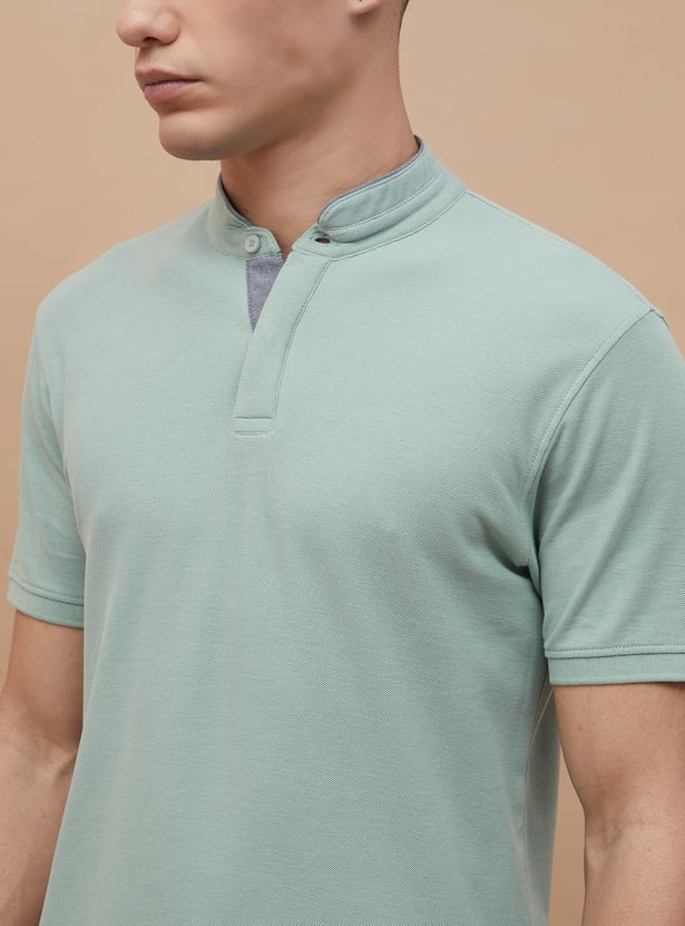 Buy CODE Solid Regular Fit T-shirt from CODE at just INR 999.0