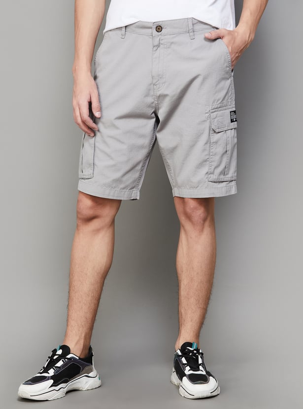 Buy BOSSINI Men Solid Cargo Shorts from Bossini at just INR 1699.0